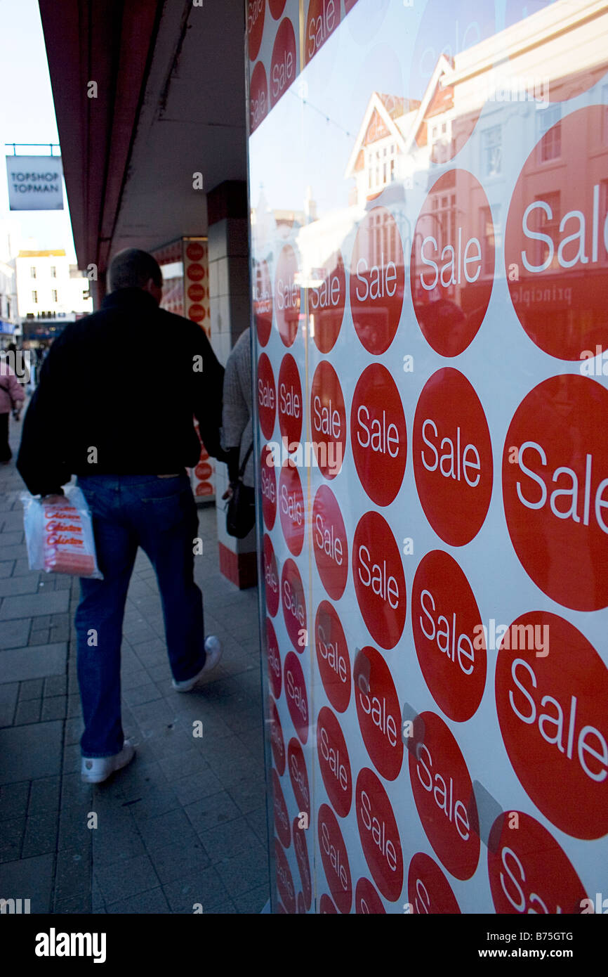 major store window display plastered with sale signs Stock Photo - Alamy