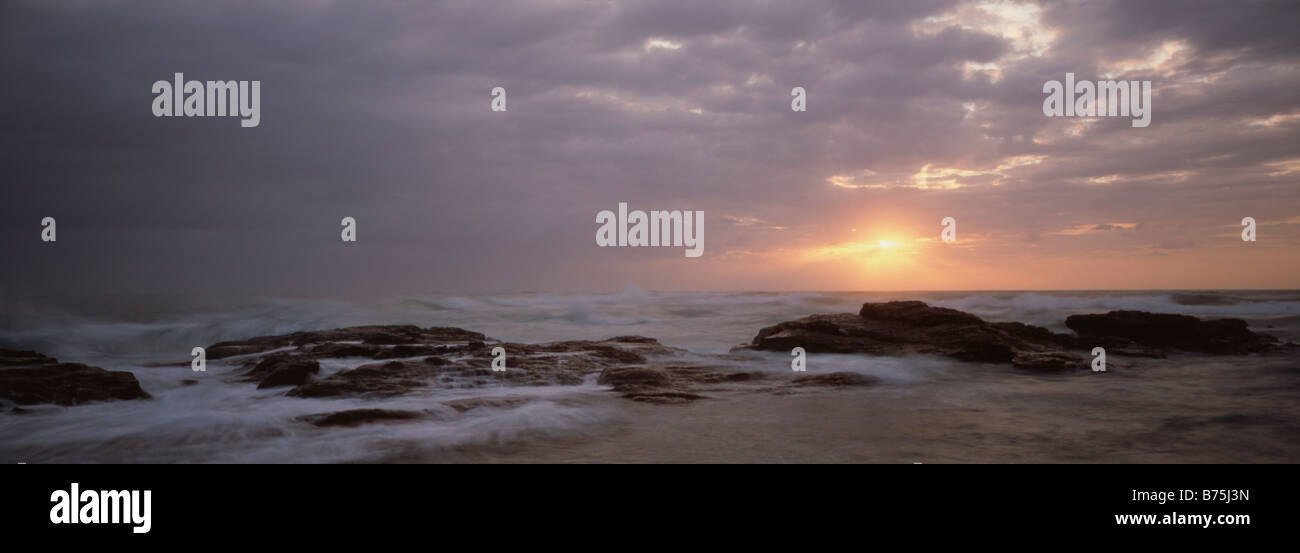 An abating low pressure system left rough seas on a beach awash with ...