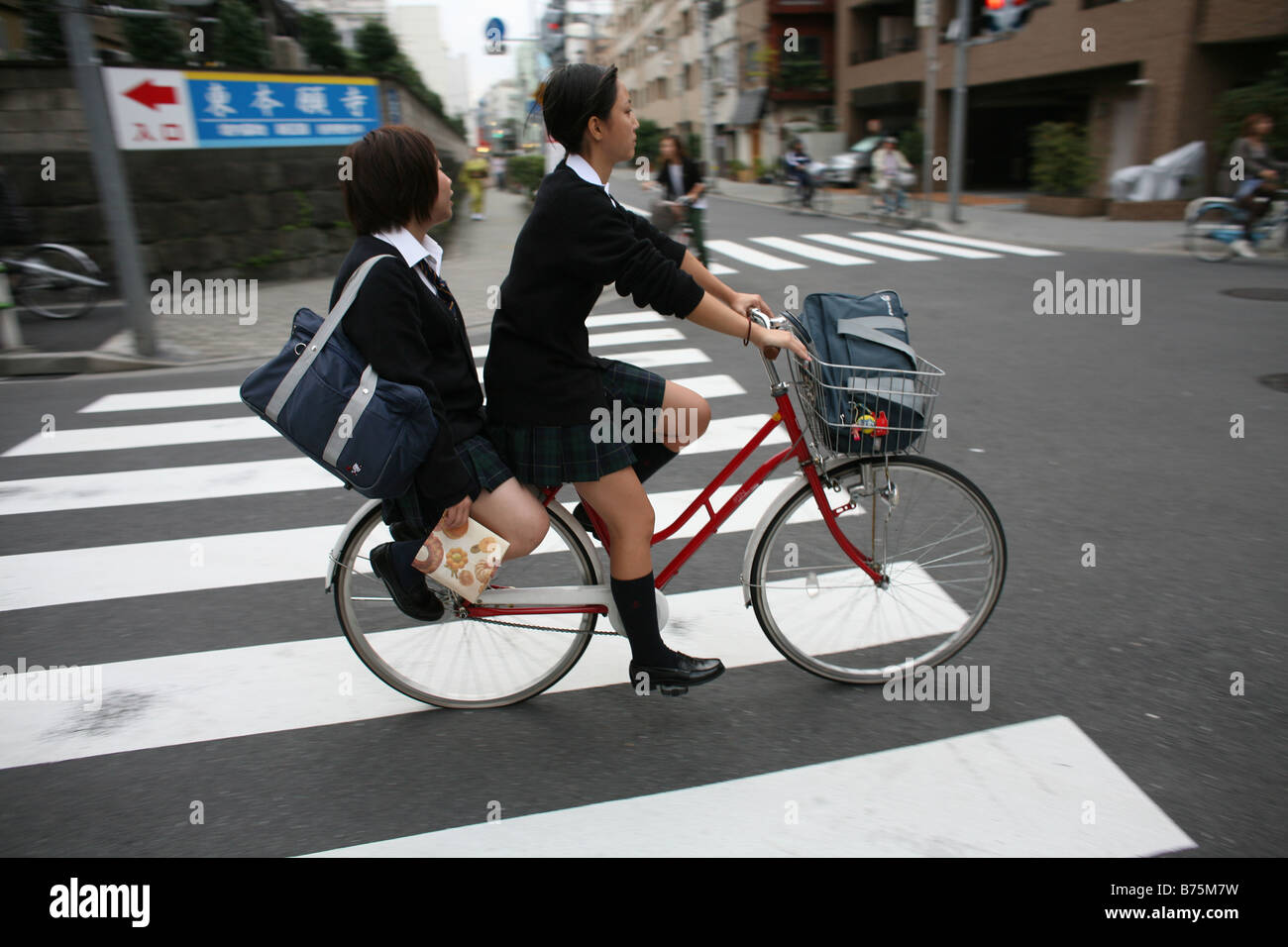Japanese student on her way to school in Tokyo Japan Stock Photo - Alamy