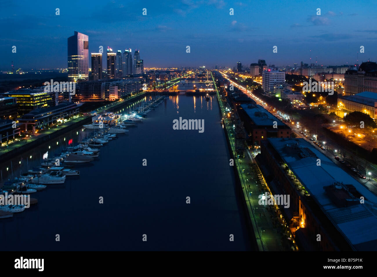 Buildings lit up at night in a city Stock Photo - Alamy