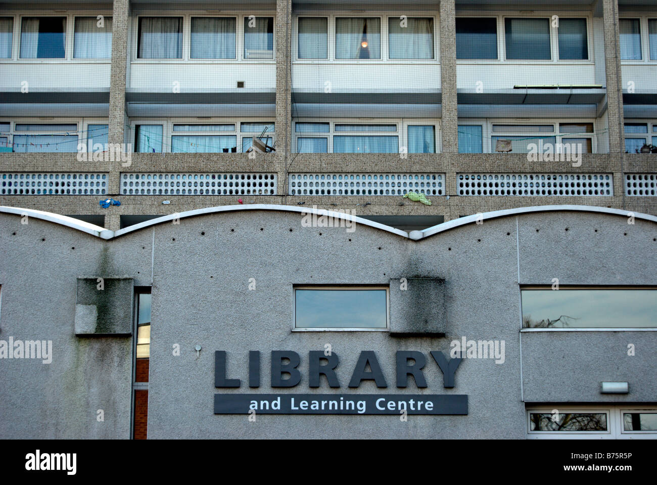 sign for library and learning centre adjacent to a towerblock on the ...