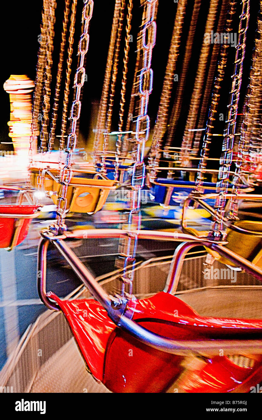Spinning swings amusement park hi-res stock photography and images - Alamy