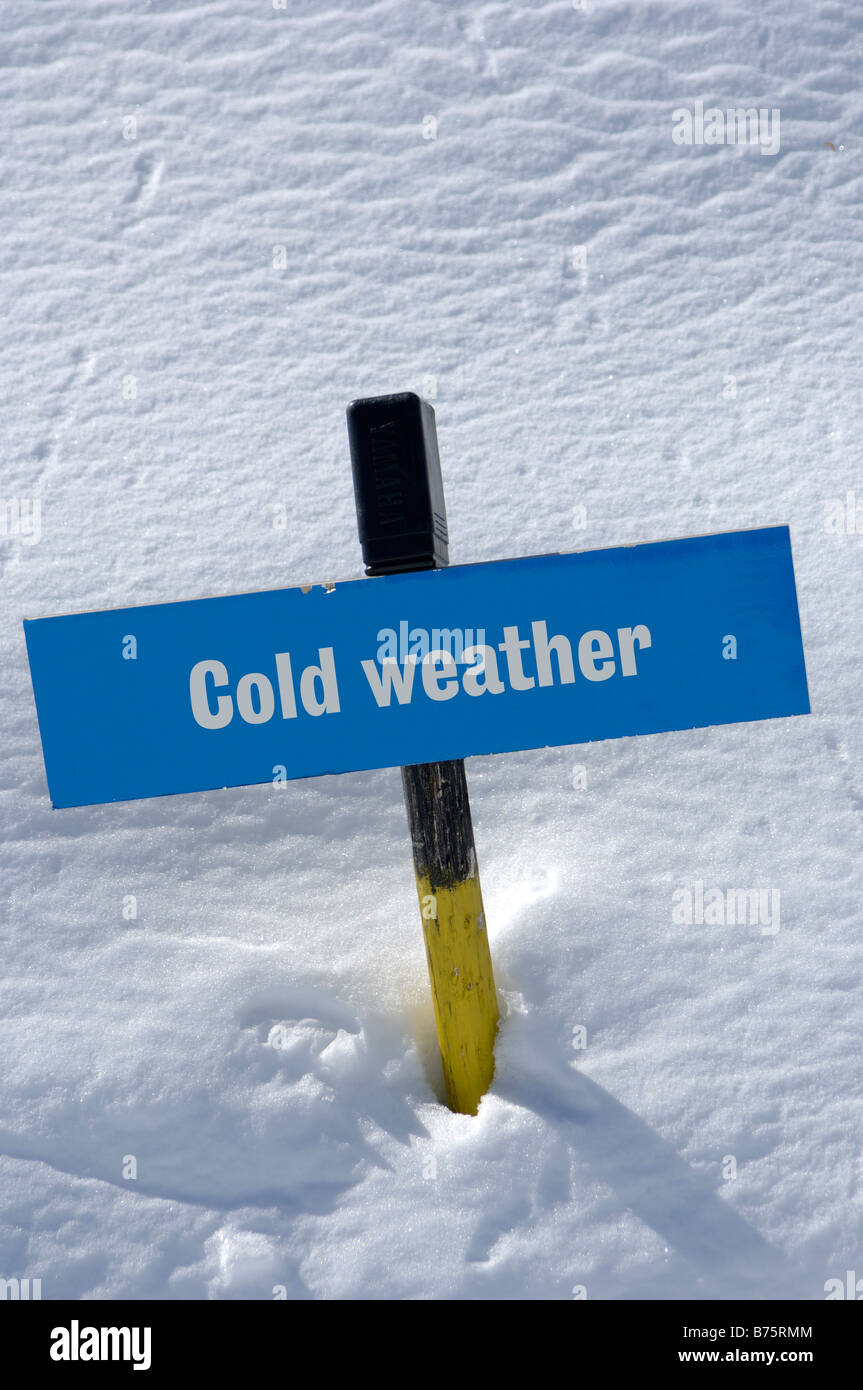 Cold weather sign in snow Stock Photo - Alamy