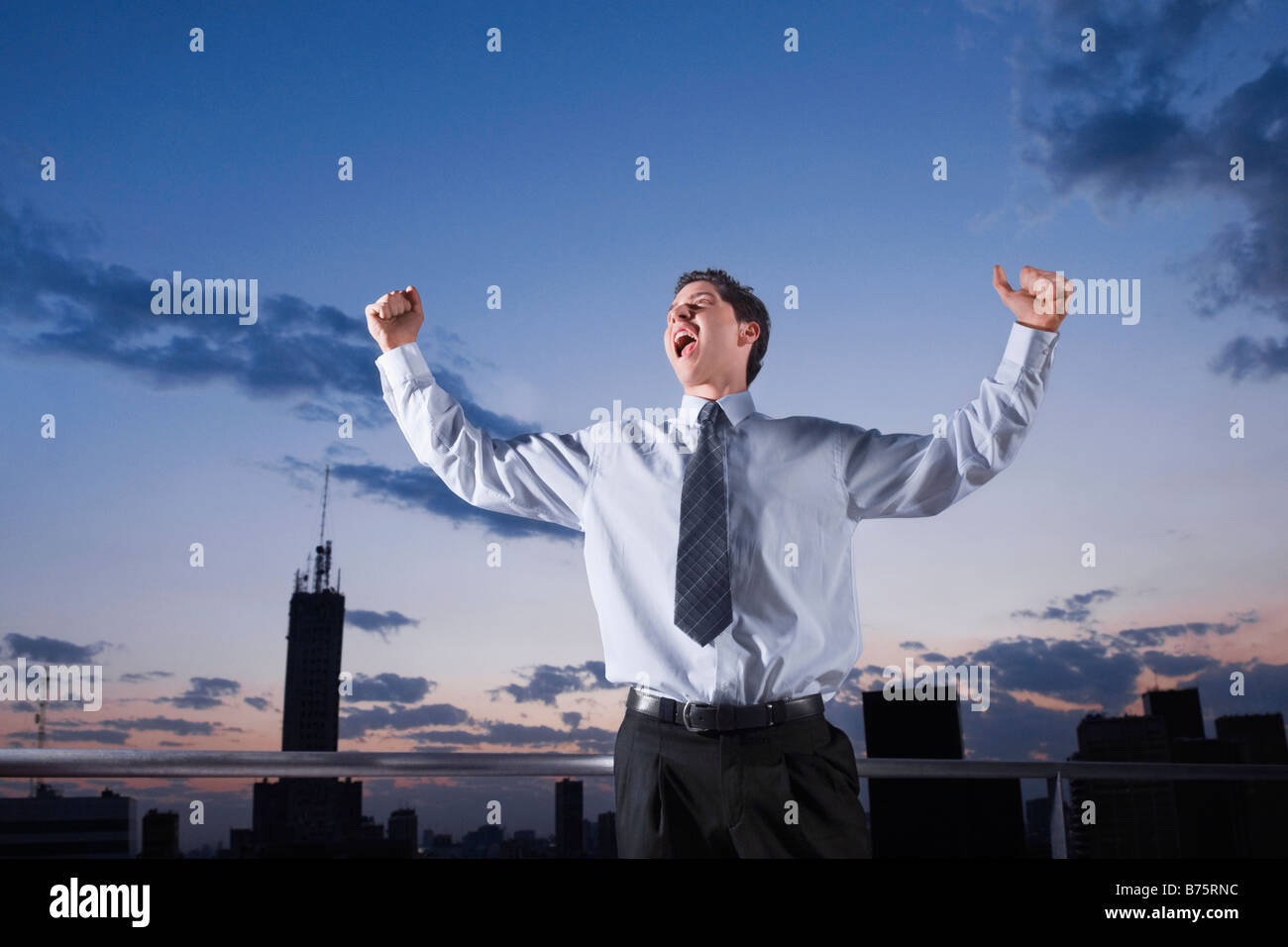 Businessman shouting with his arms outstretched Stock Photo - Alamy