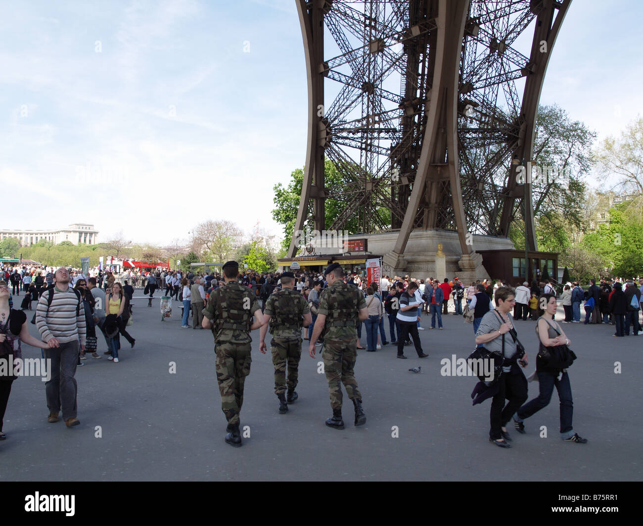 French soldiers patrol beneath the Eiffel Tower Paris France Stock ...