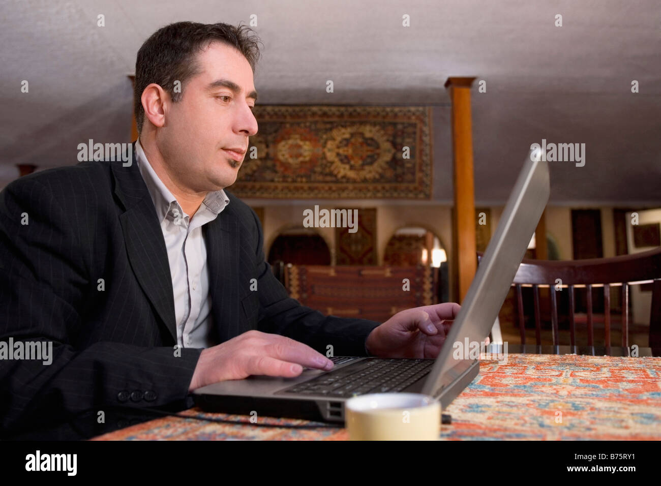 Attentive male executive working on hi-res stock photography and images ...