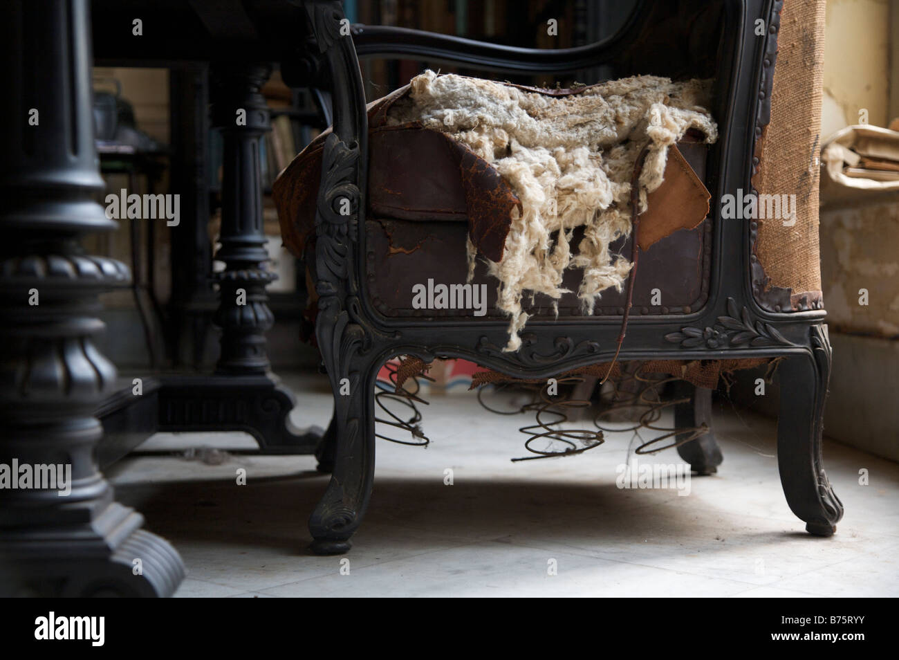 Old chair with broken springs Stock Photo - Alamy