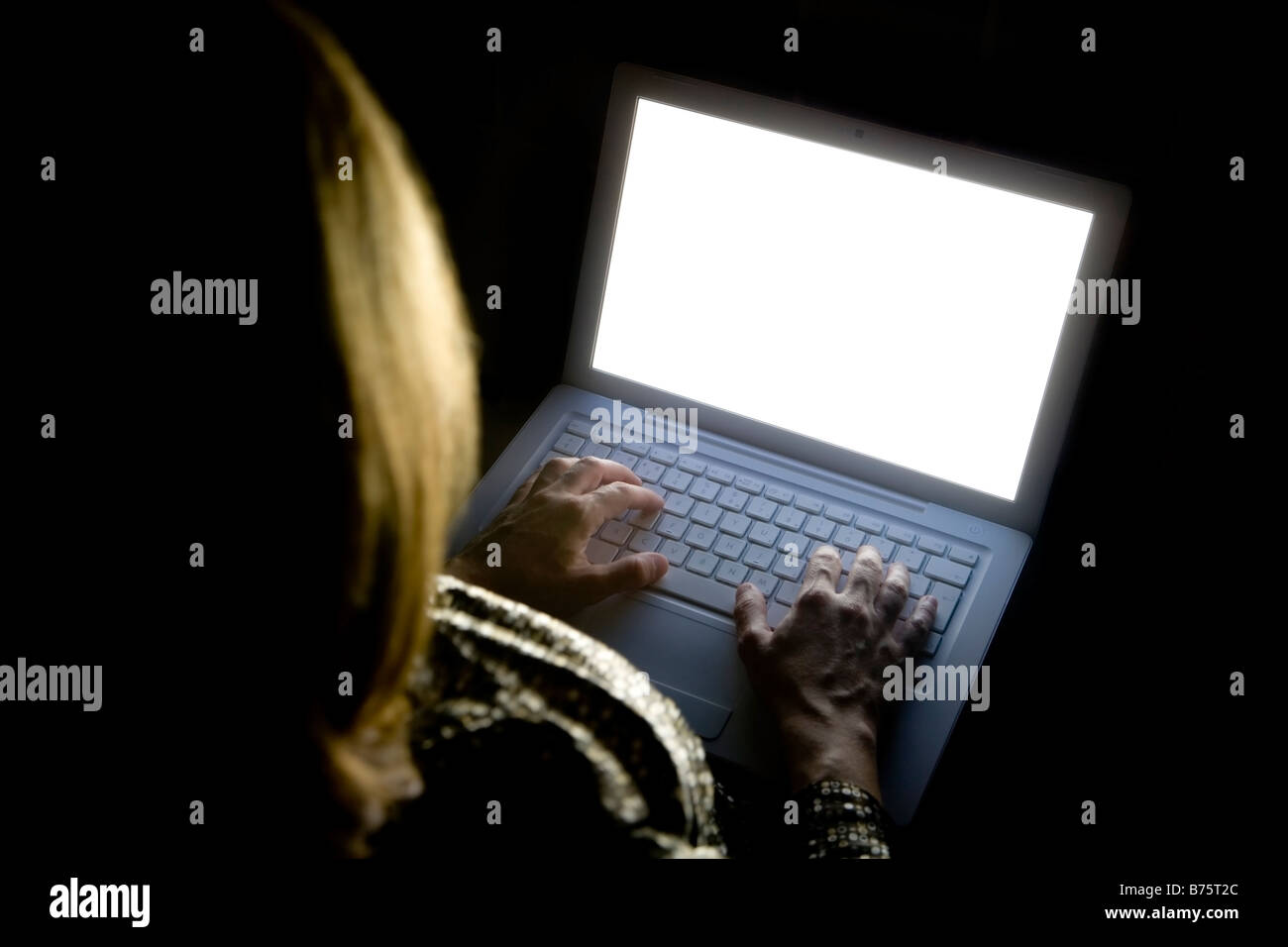 female woman typing a letter in the keyboard of Stylish laptop computer ...