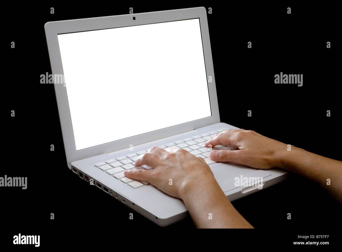 hands typing a letter in the keyboard of Stylish laptop computer with ...