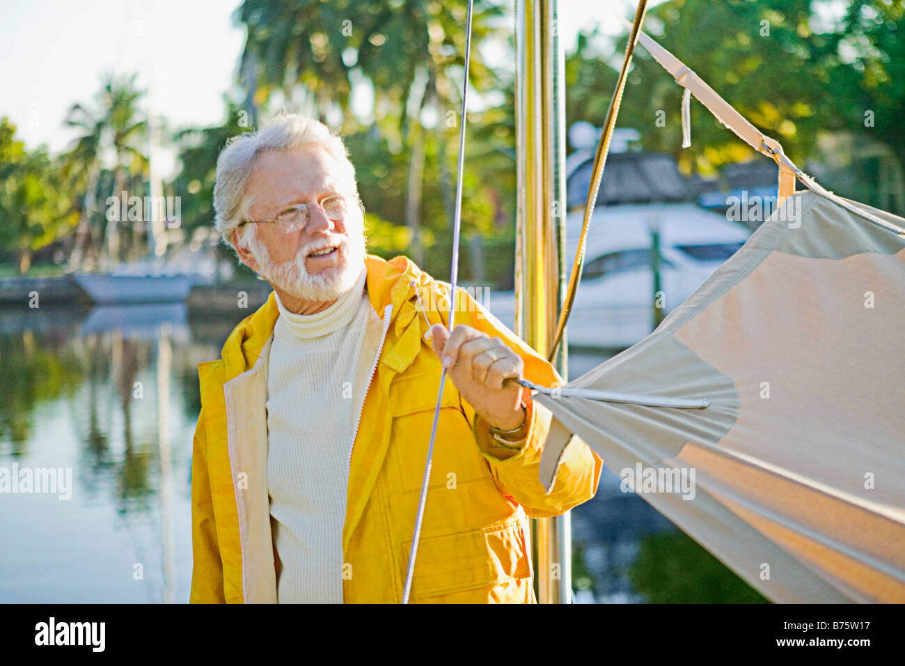 Senior man standing on a ship and thinking Stock Photo - Alamy