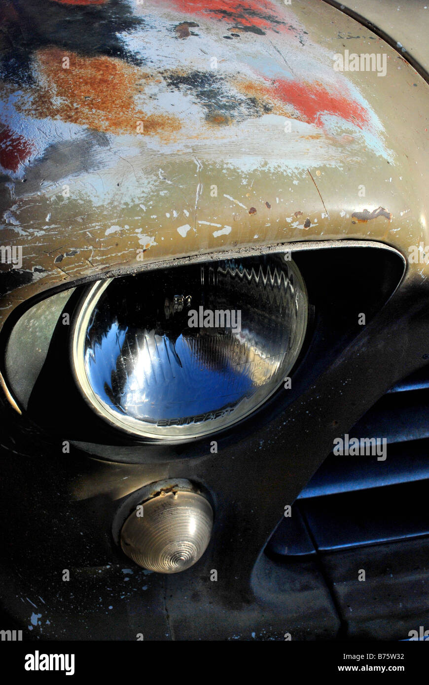 Vintage classic car in disrepair and rusting front light Stock Photo ...