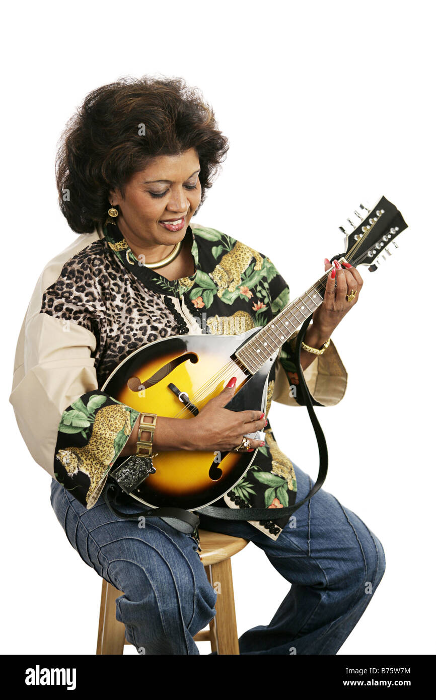 A pretty ethnic woman playing a mandolin Isolated on white Stock Photo ...