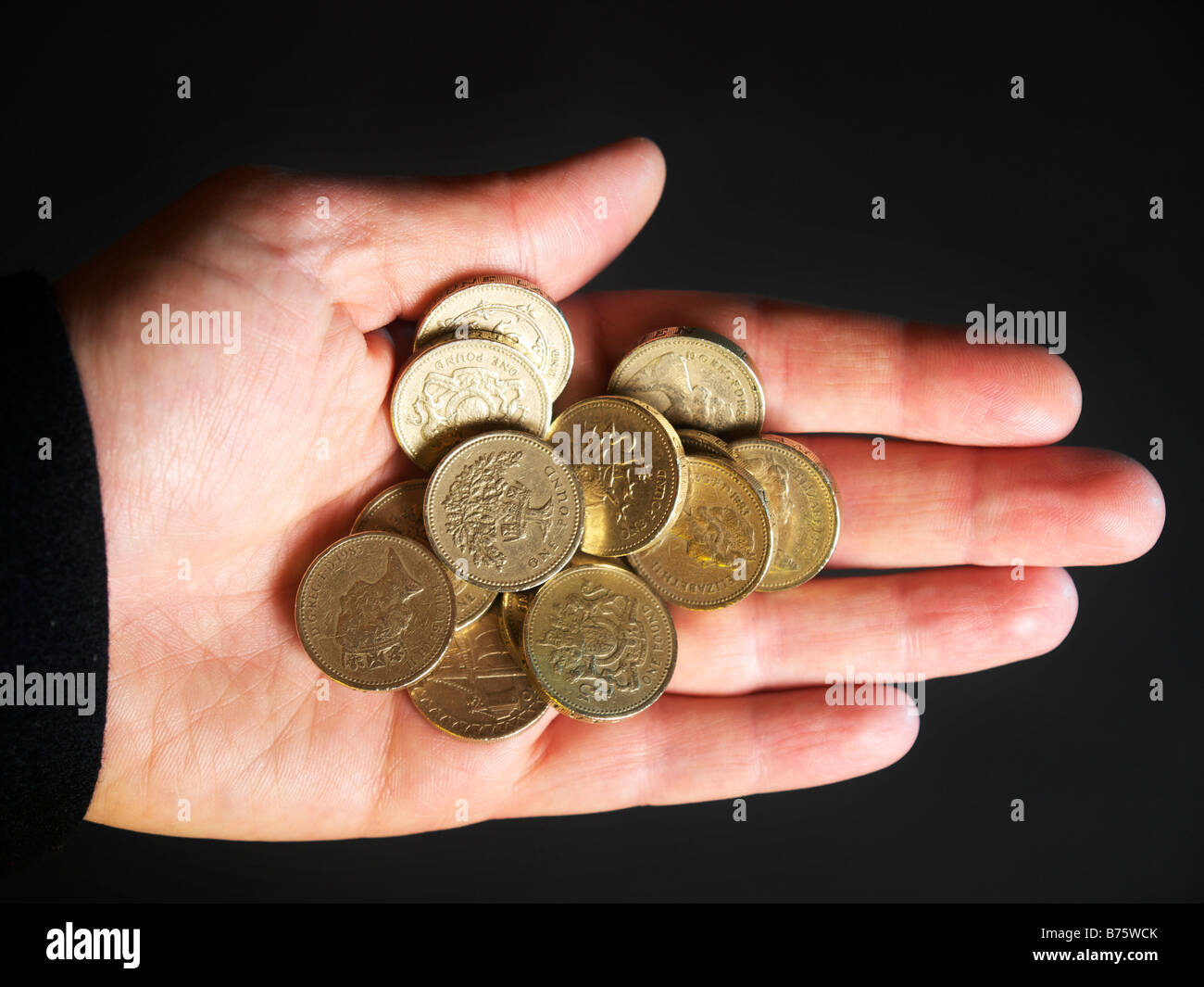 Hand holding bag of coins hi-res stock photography and images - Alamy