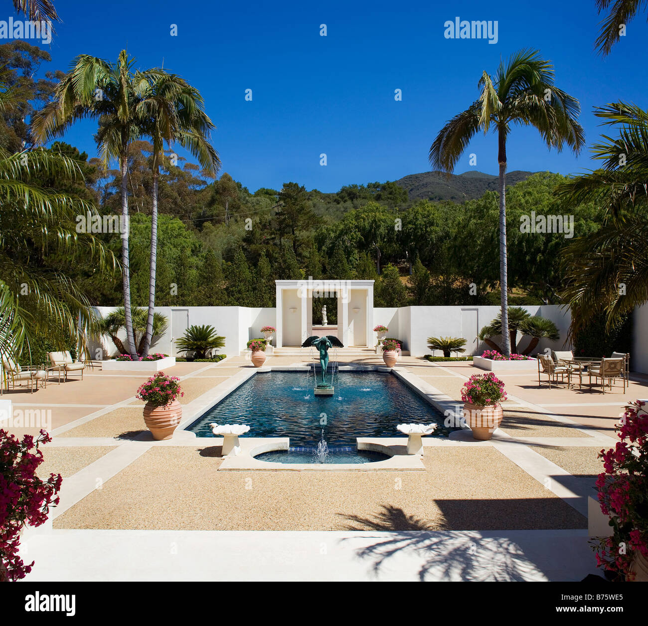 Large elegant swimming pool with statue Stock Photo - Alamy