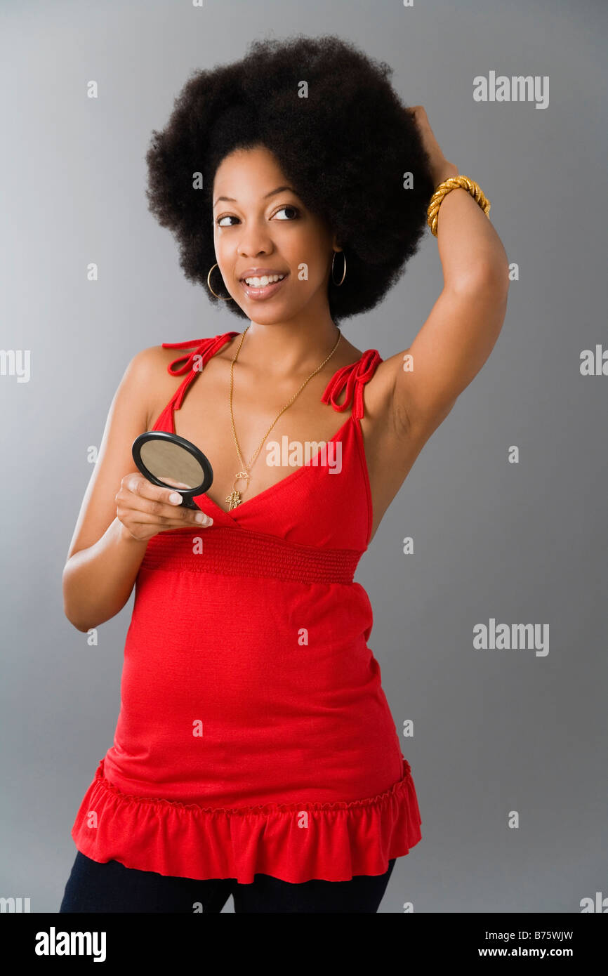 Woman looking sideways into a mirror hi-res stock photography and ...
