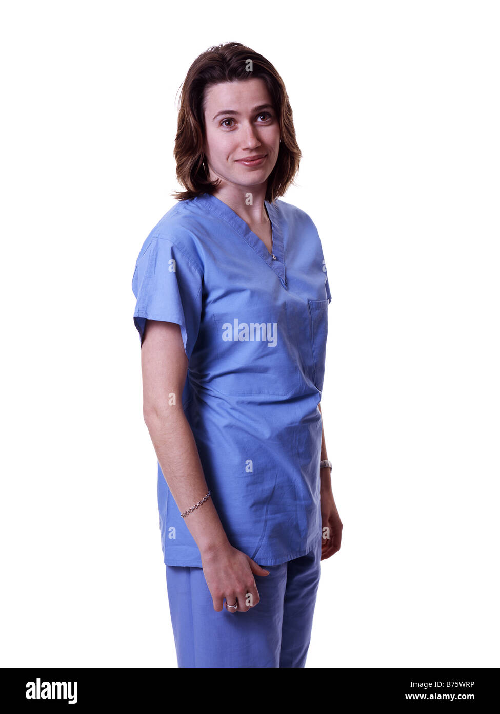 Smiling Female Healthcare Professional in Scrubs against White ...