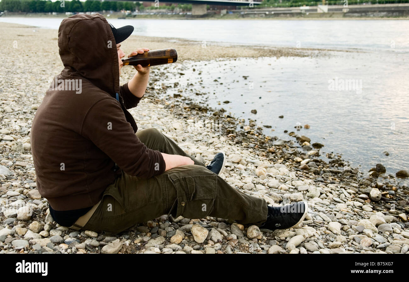 Teenage boy drinking alcohol outside hi-res stock photography and ...