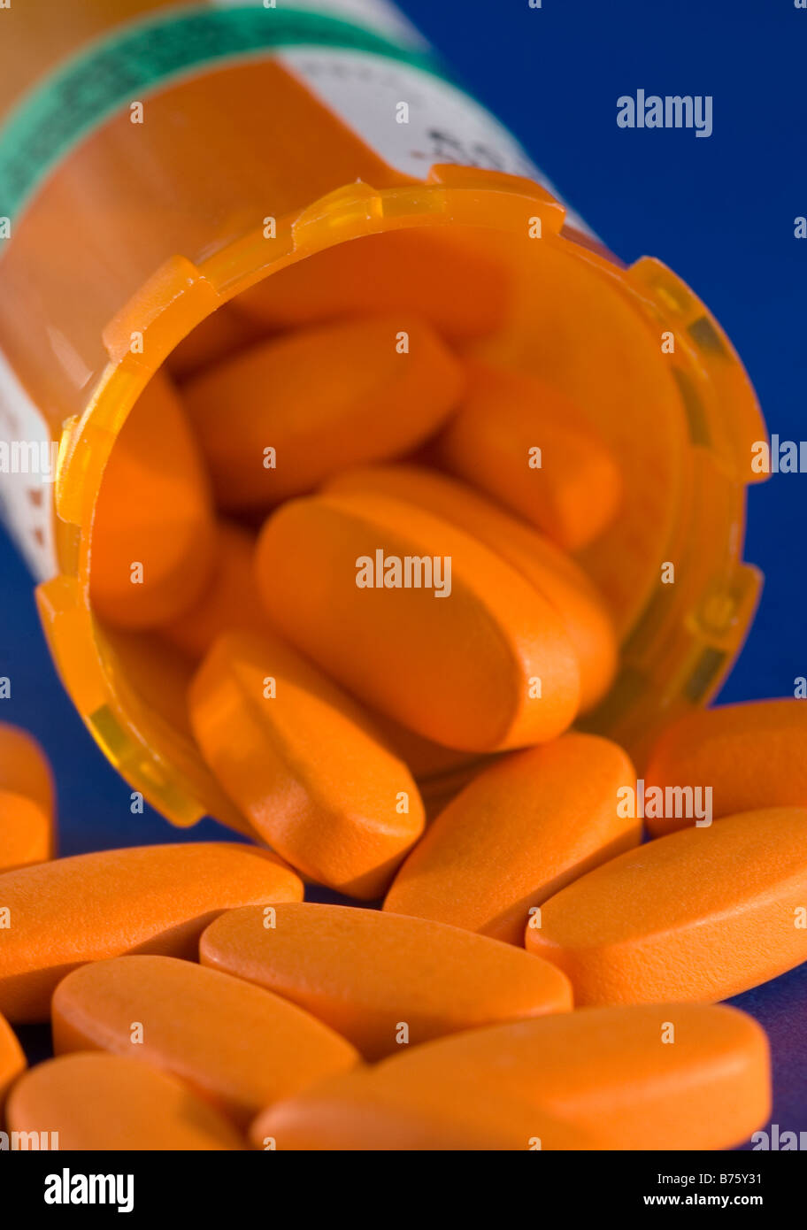 Tablets spilling onto table Stock Photo - Alamy