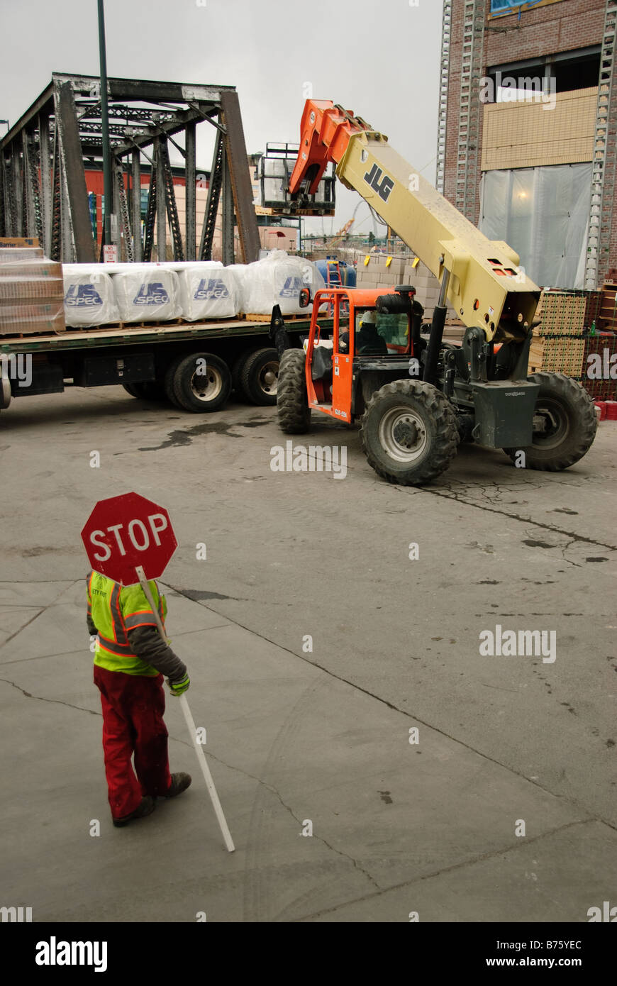 Unloading suplies at construction site Stock Photo - Alamy