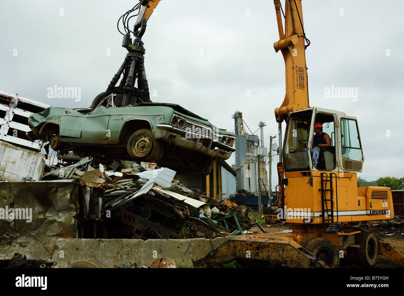 Old car getting scrapped Stock Photo - Alamy