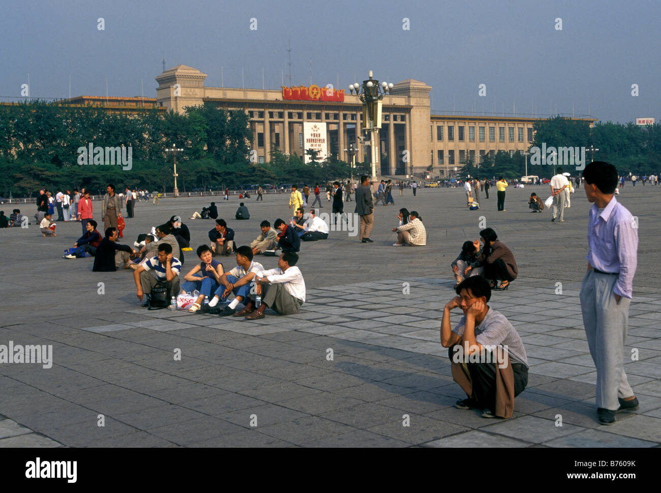 Chinese people, men and women, sitting, relaxing, Tiananmen Square ...