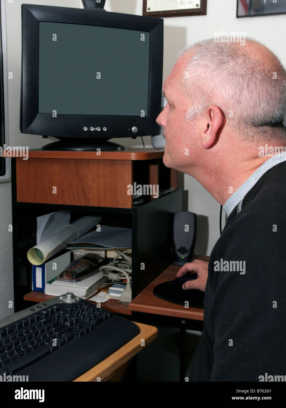 A meteorologist tracking the weather on his computer screen is blank ...