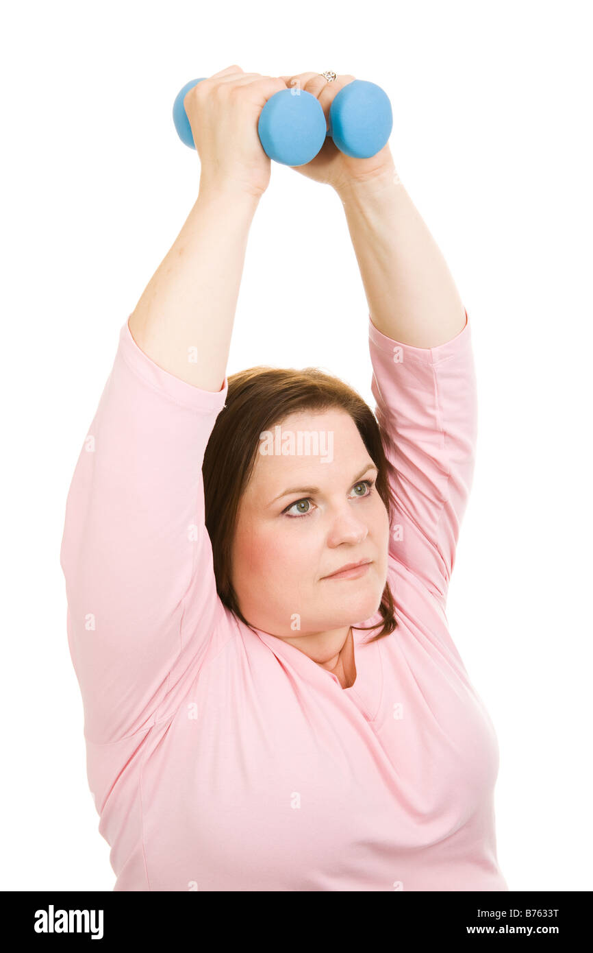 Beautiful plus sized model doing pilates with free weights Isolated on ...