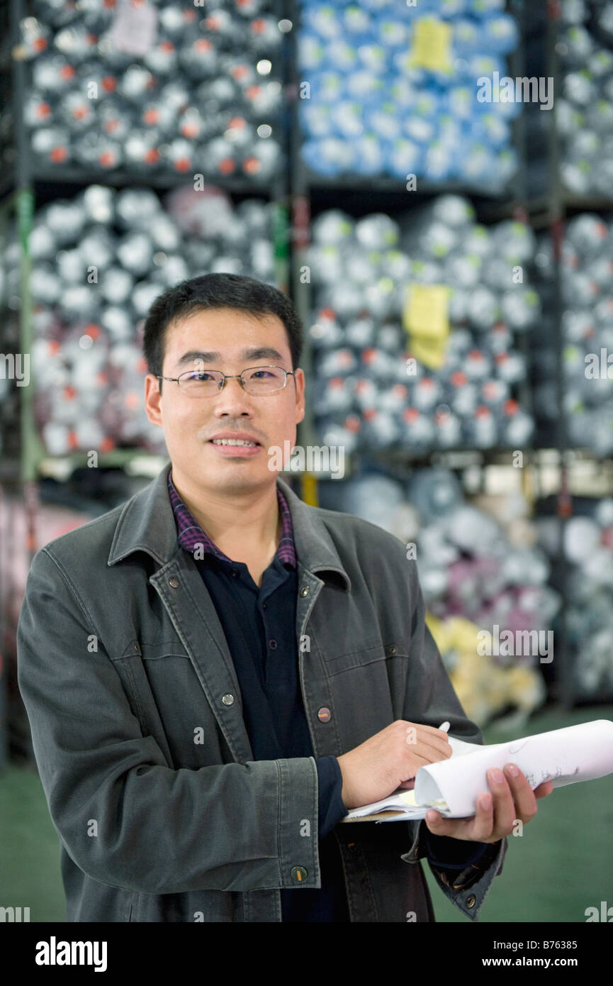 An employee at a warehouse doing an inventory check Stock Photo - Alamy