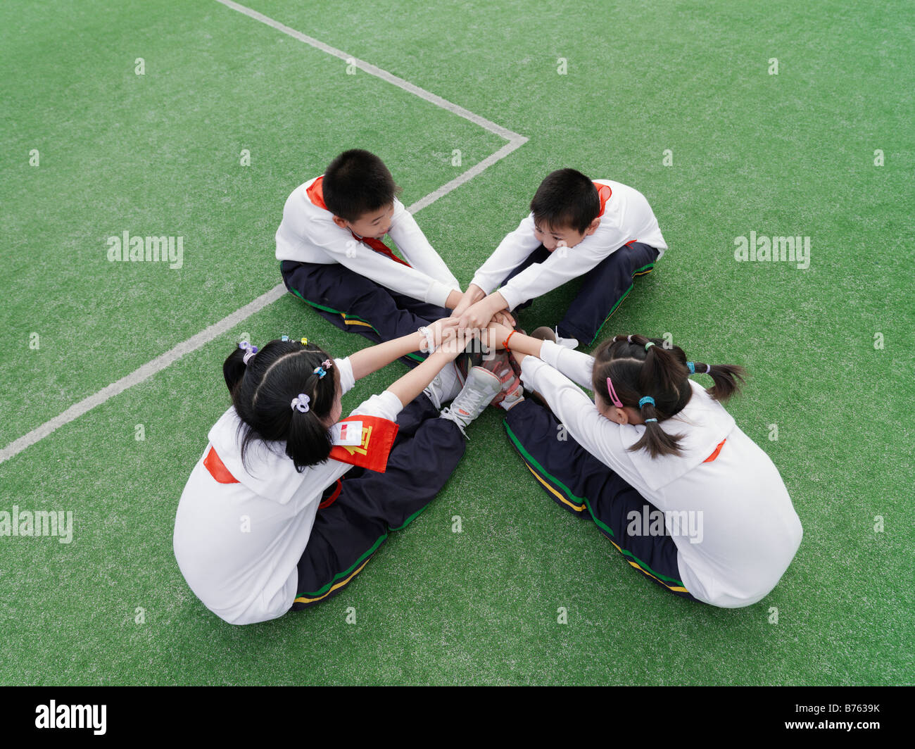 School children stretching during a physical fitness class Stock Photo ...