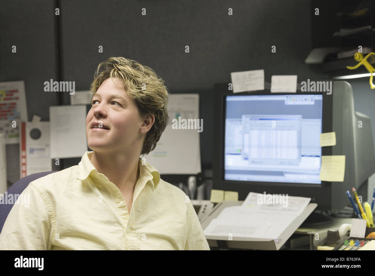 Male customer service representative smiling in an office Stock Photo ...