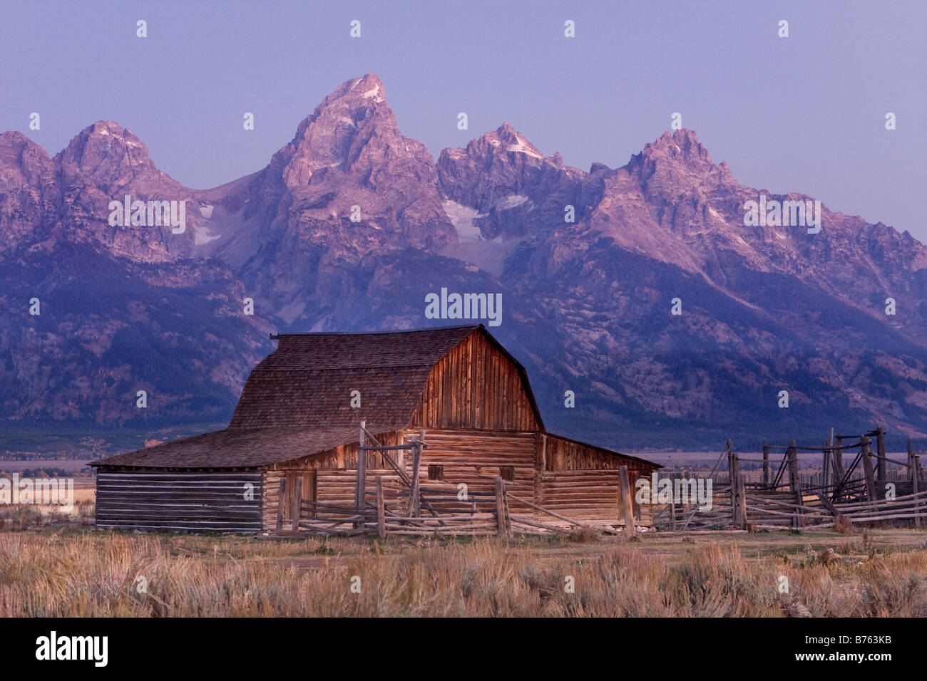 Grand Teton above a ranch along Mormon Row before sunrise Grand Teton ...