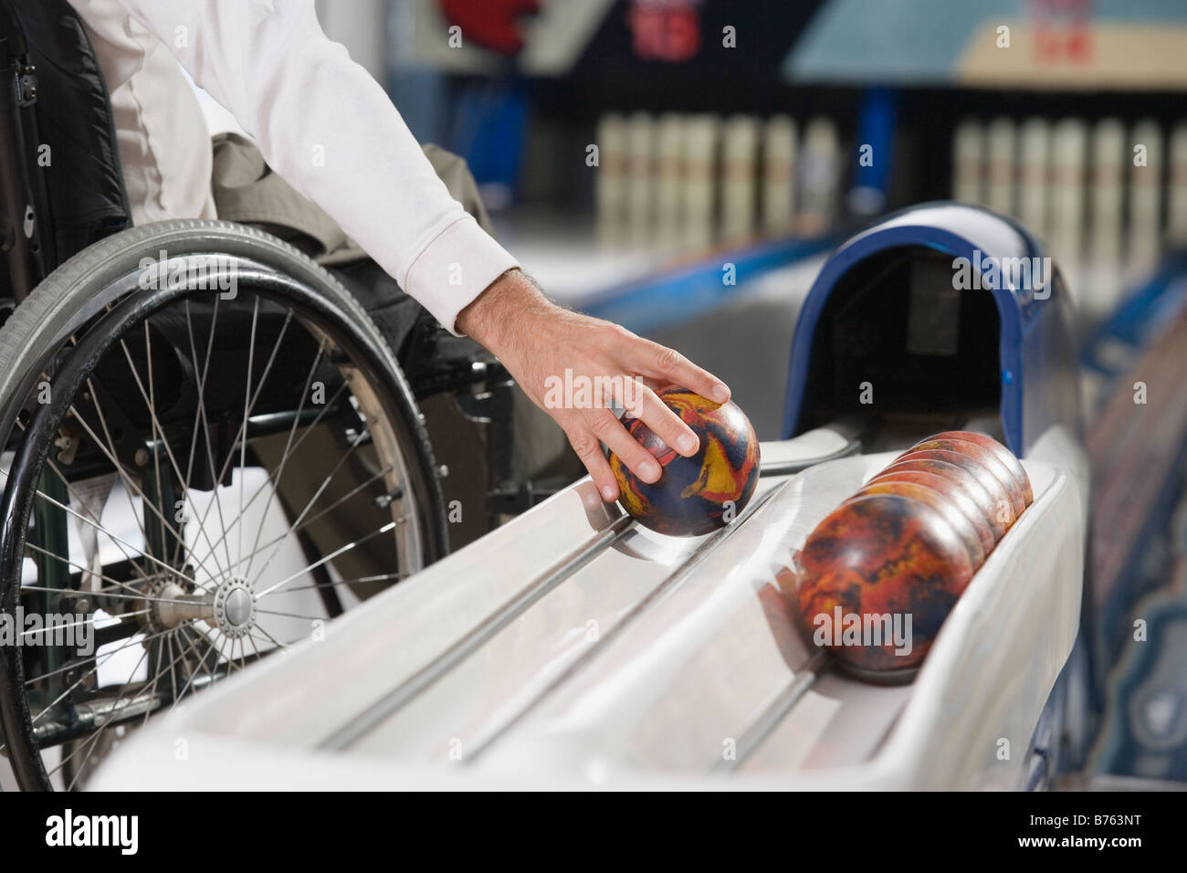 Mid section view of a disabled man playing ten pin bowling Stock Photo ...