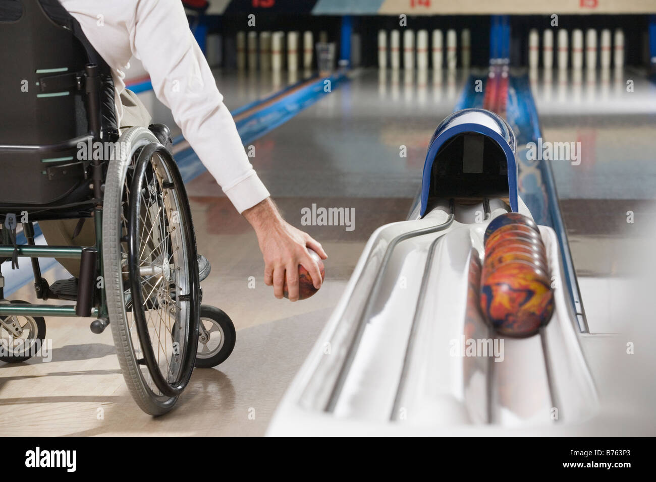 Low section view of a disabled man playing ten pin bowling Stock Photo ...