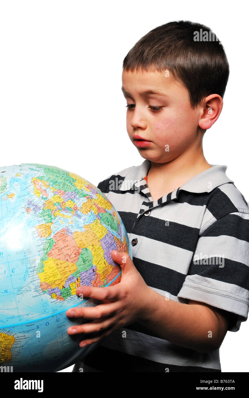 A young boy searching the globe Stock Photo - Alamy