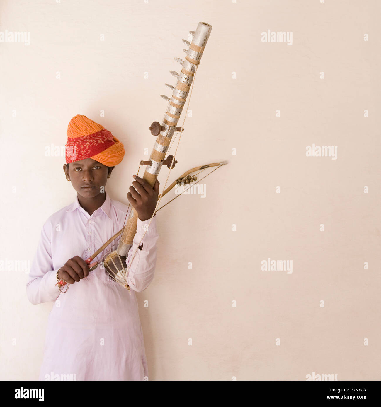 Portrait of a boy playing a musical instrument Stock Photo - Alamy