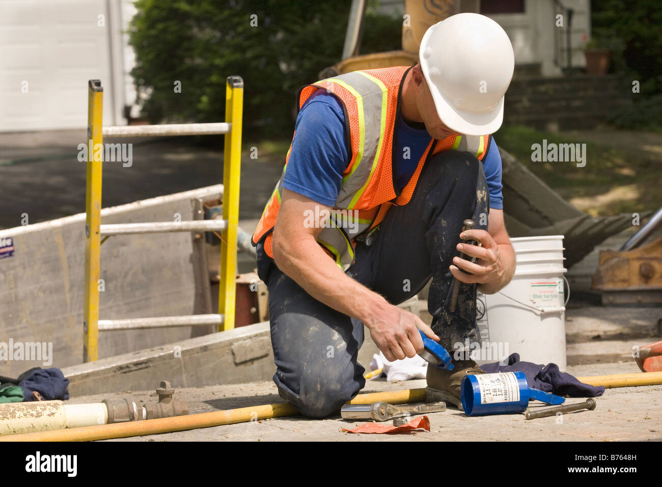 Worker on construction site Stock Photo - Alamy