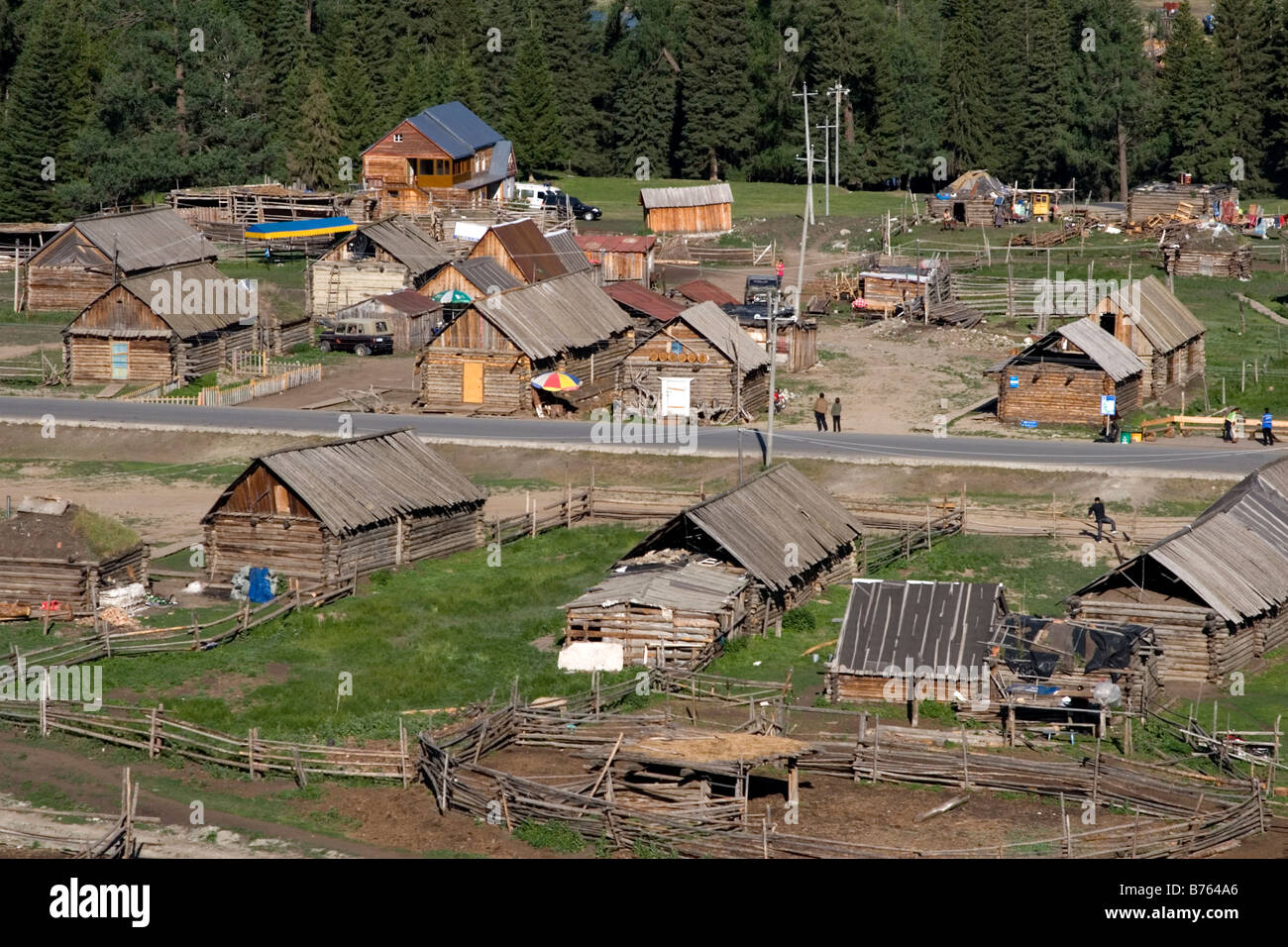 Log cabins at Tuwa village in Kanas National Park in Xinjiang in China ...