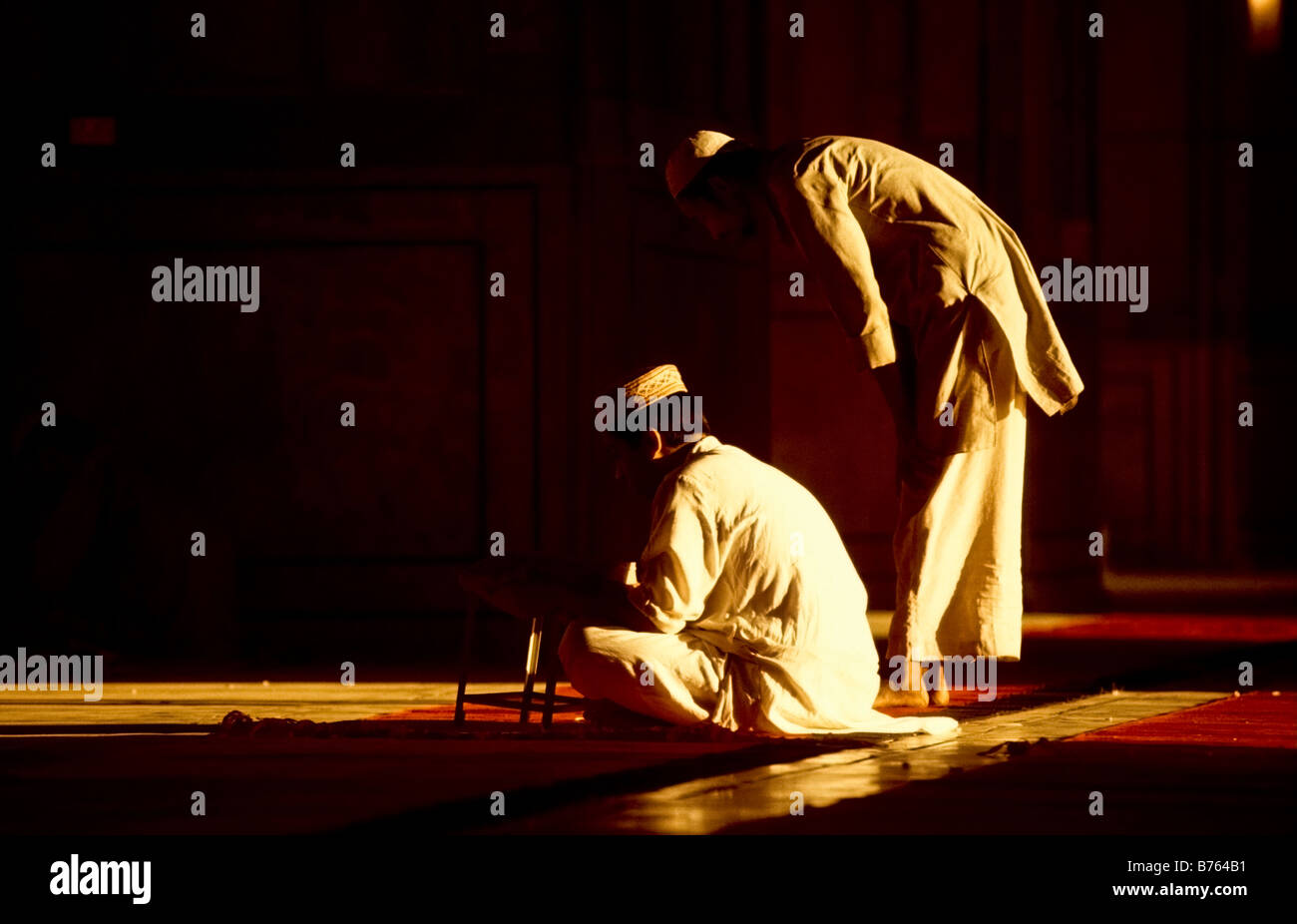 Two muslim men praying at jama masjid, old delhi, India Stock Photo - Alamy