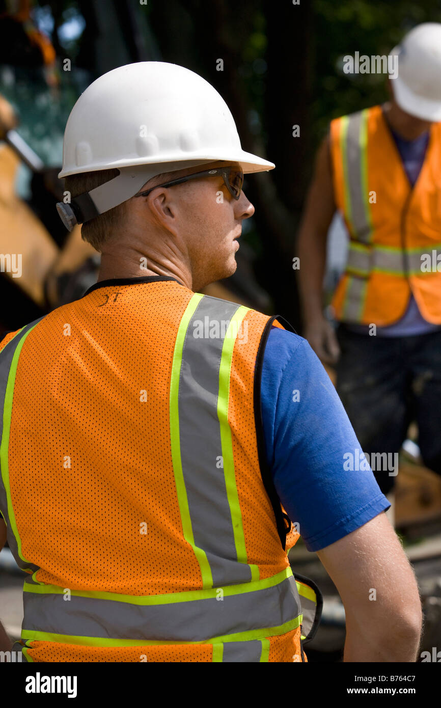Workers on construction site Stock Photo - Alamy