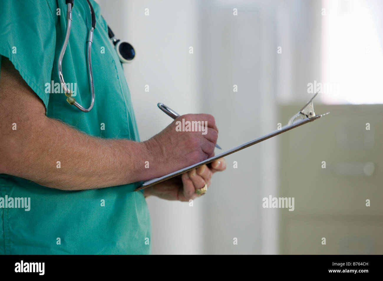 Mid section view doctor writing hi-res stock photography and images - Alamy