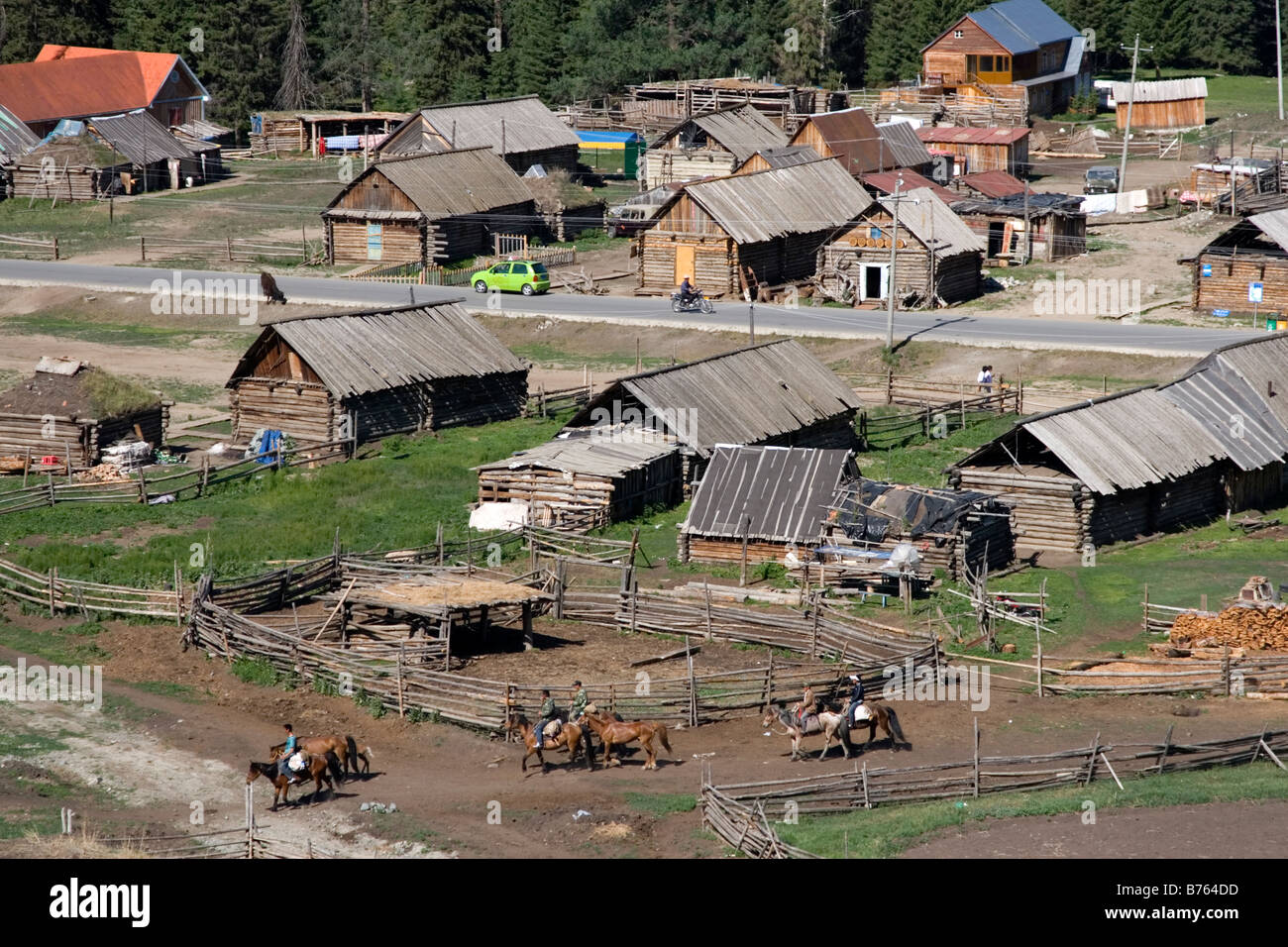 Log cabins at Tuwa village in Kanas National Park in Xinjiang in China ...