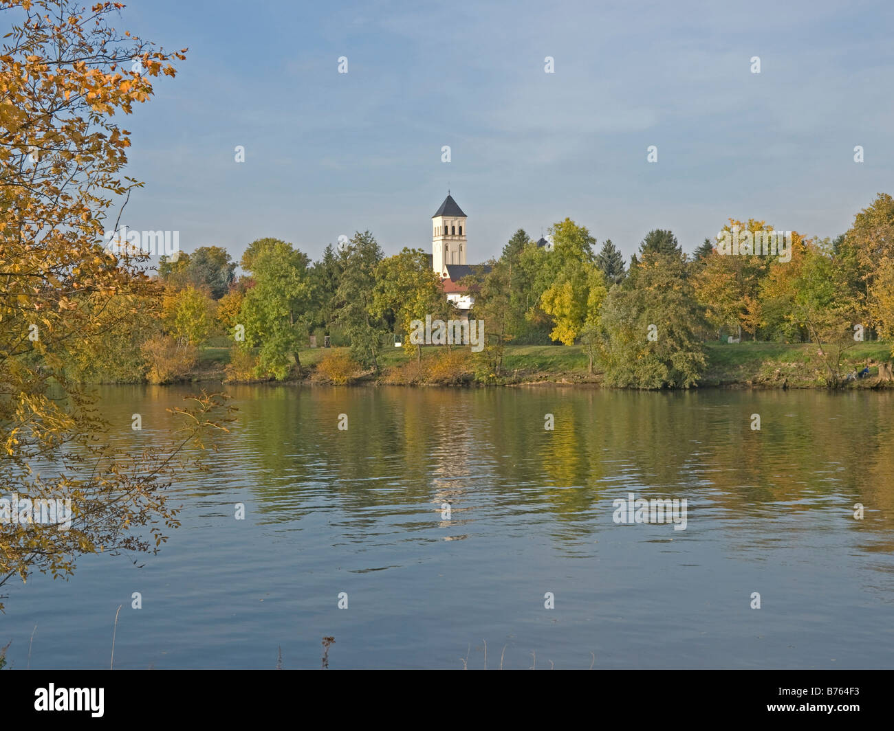 the river Main by Schwanheim in autumn with view to the spire steeple ...