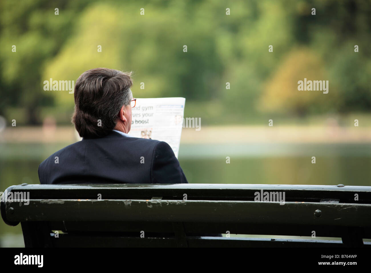 Man reading newspaper Stock Photo - Alamy