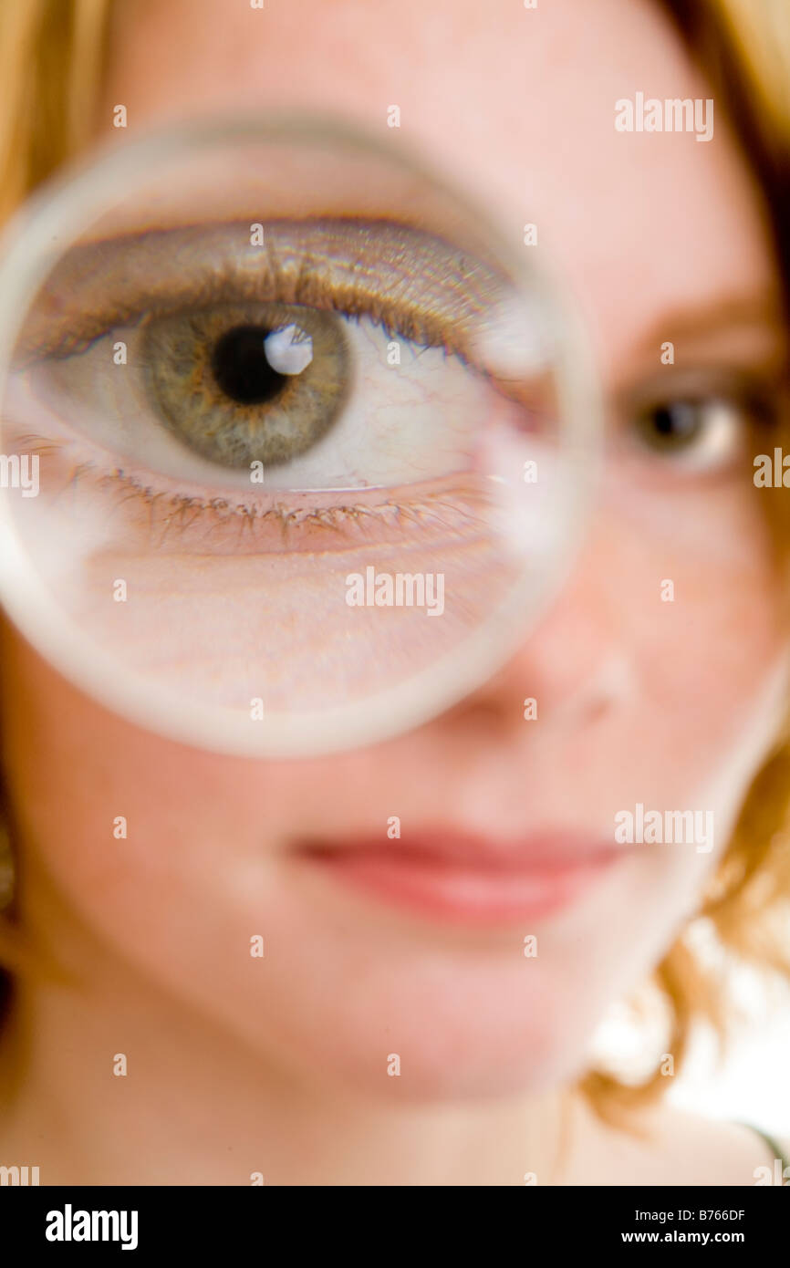 woman with loupe Stock Photo - Alamy