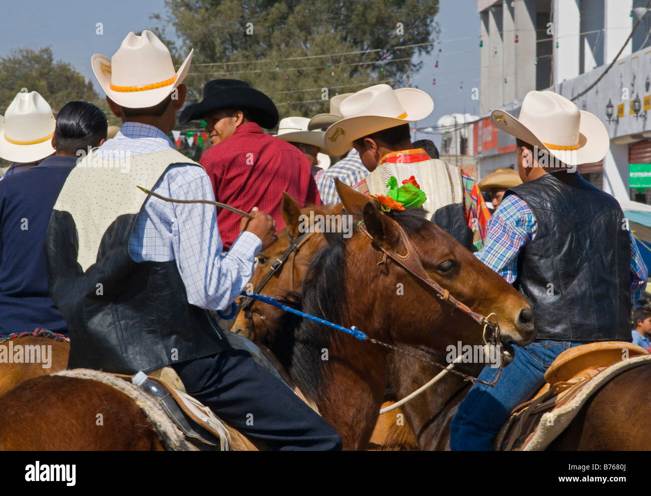 CABALLEROS or Mexican cowboys ride into town at the festival of the ...