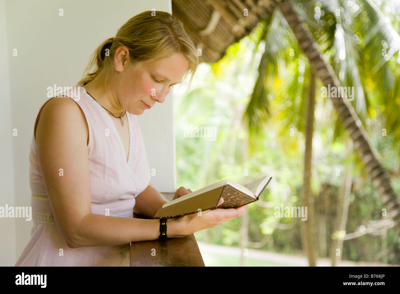 girl reading a book Stock Photo - Alamy