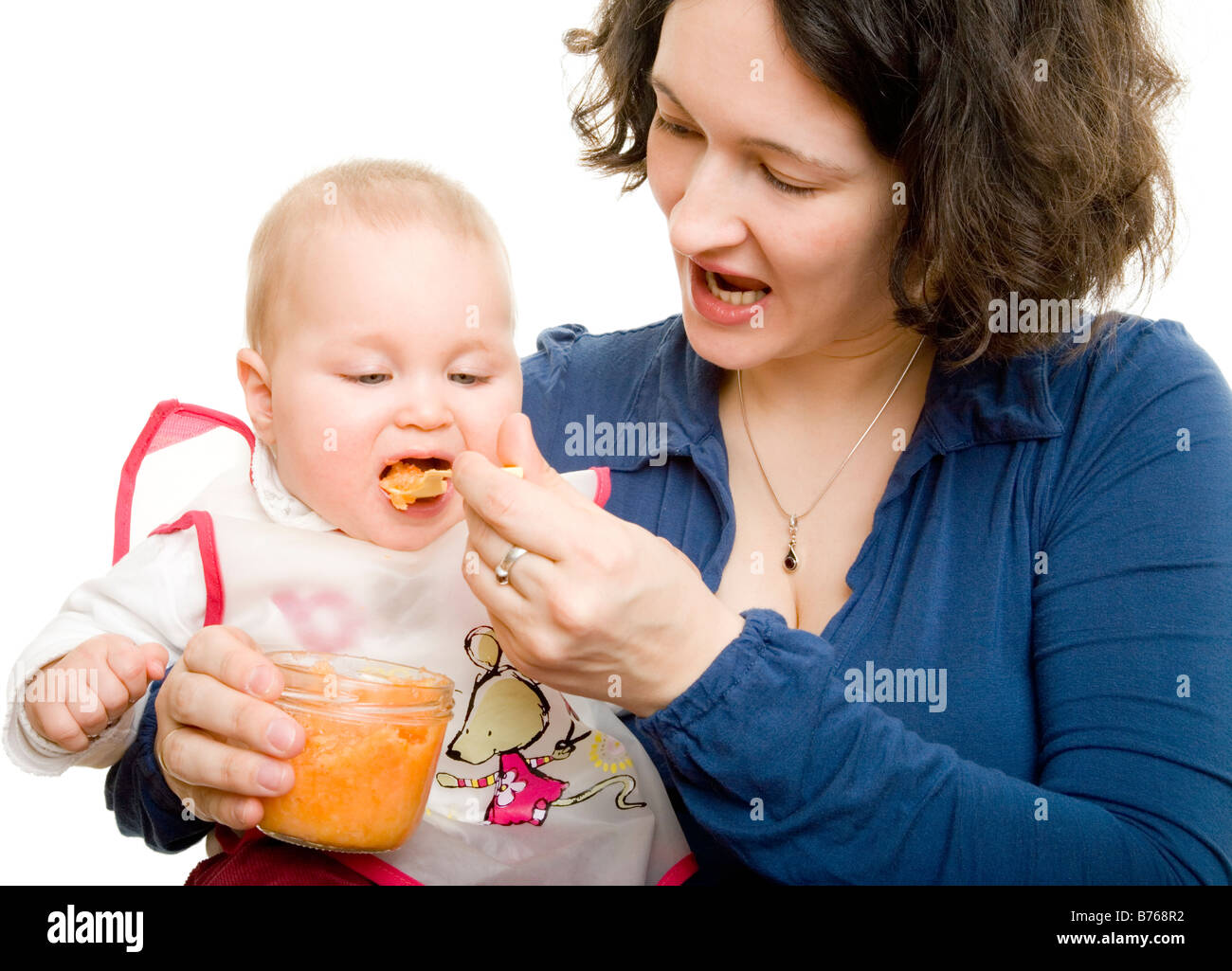 mother feeds child Stock Photo - Alamy