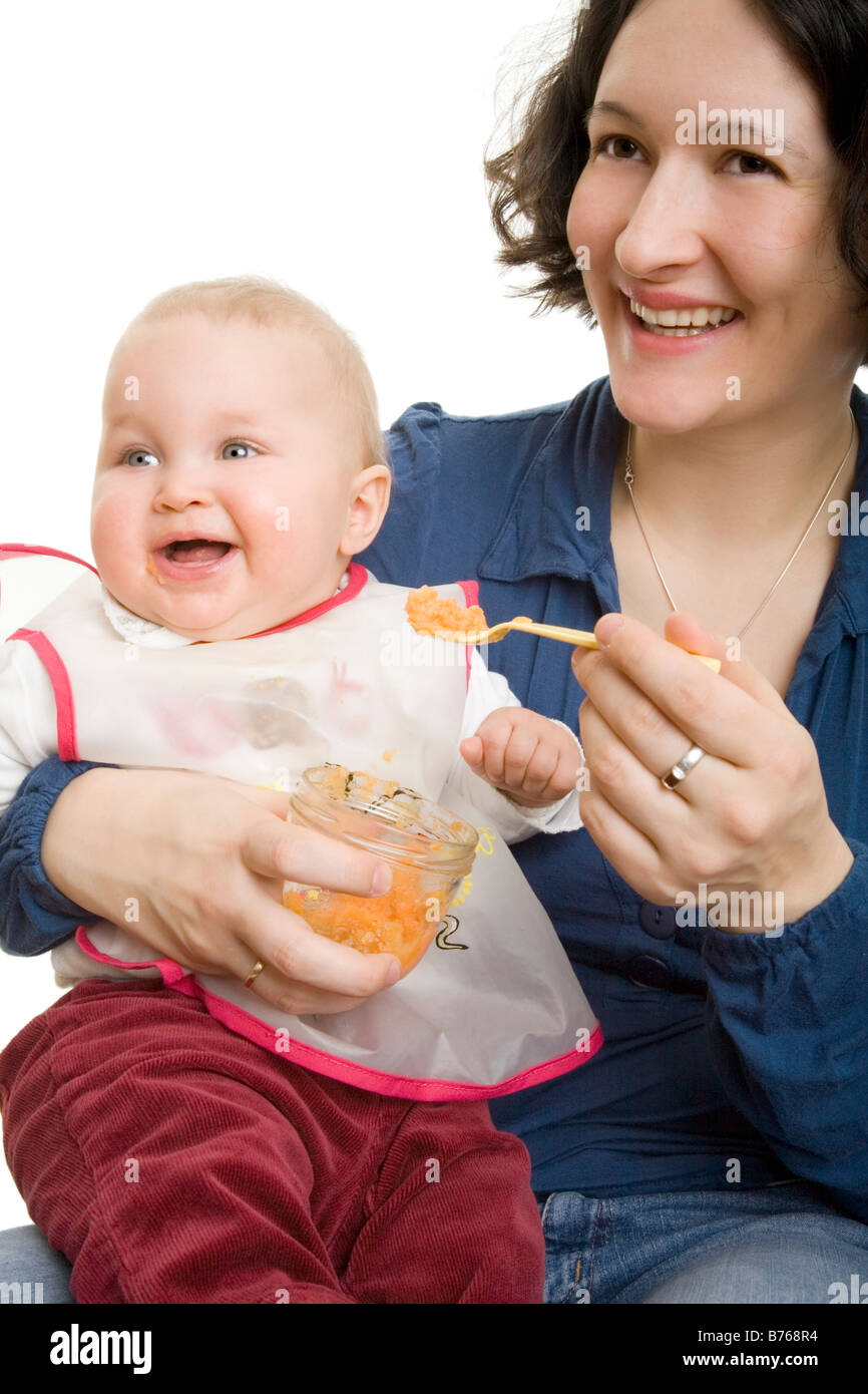 mother feed child Stock Photo - Alamy