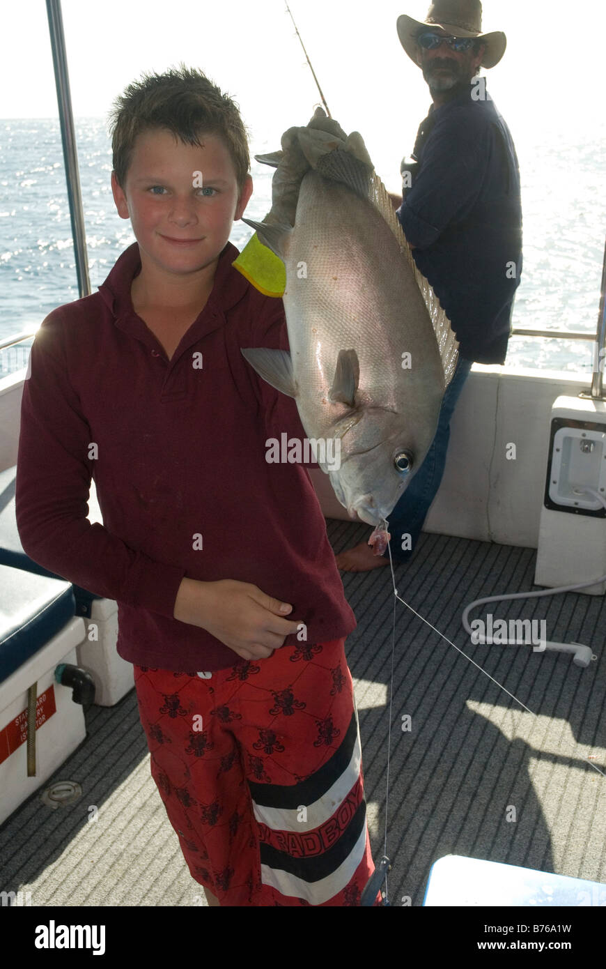 boy with reef fish Stock Photo - Alamy