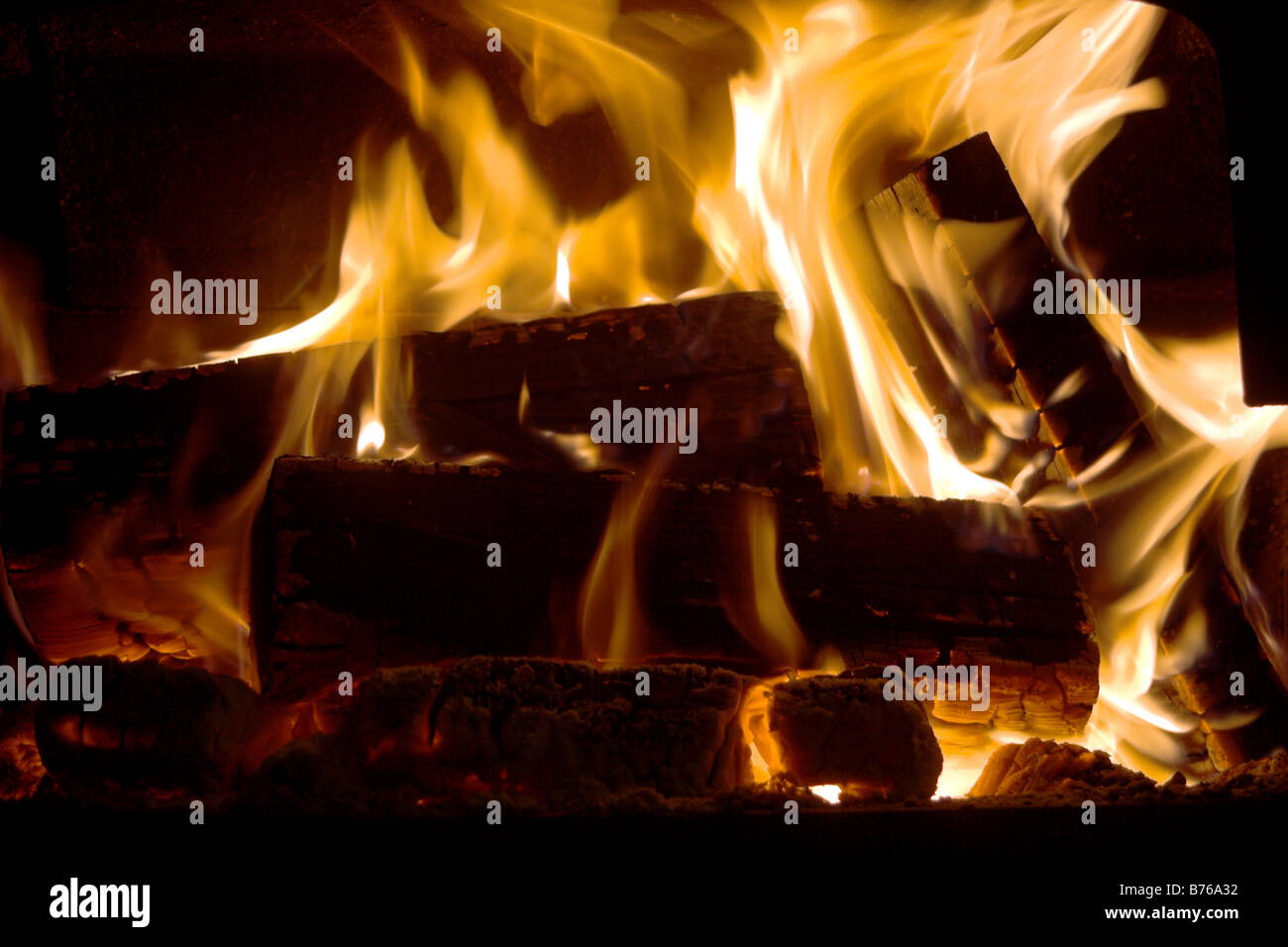 Pallet wood burning in wood burning stove Stock Photo - Alamy